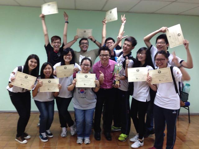 The jubilant team holding their certificates. First row from left to ...