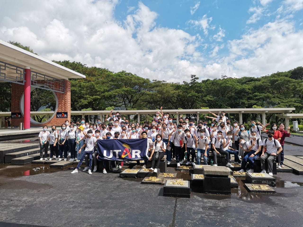 The teachers and students of Kuen Cheng High School posing for a photograph in front of Dewan ...