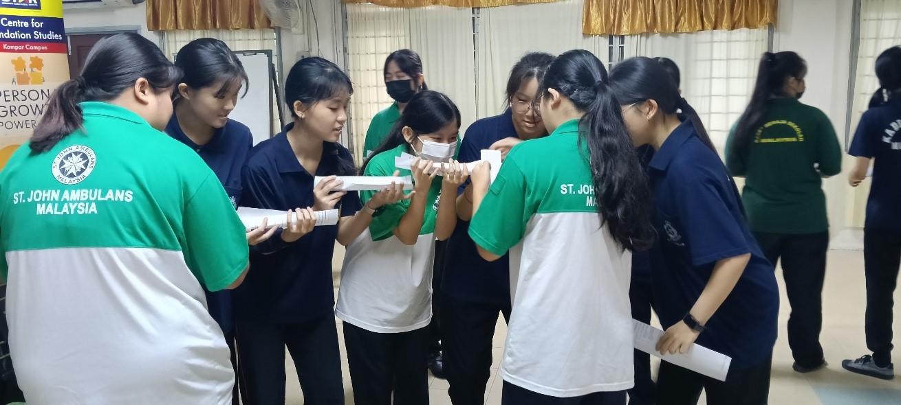 Students engaging enthusiastically in the team-building games at SMK Matang