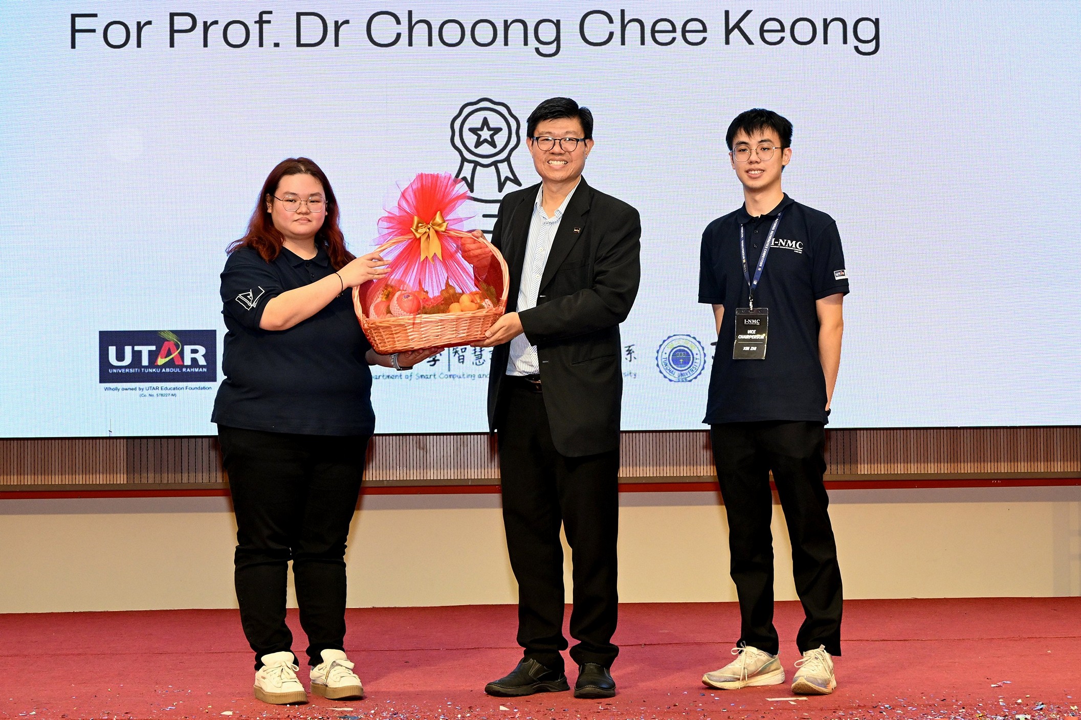 From left: Tan presenting a token of appreciation to Prof Choong ...